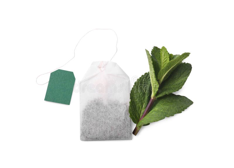 New Tea Bag with Label and Mint on White Background, Top View Stock ...