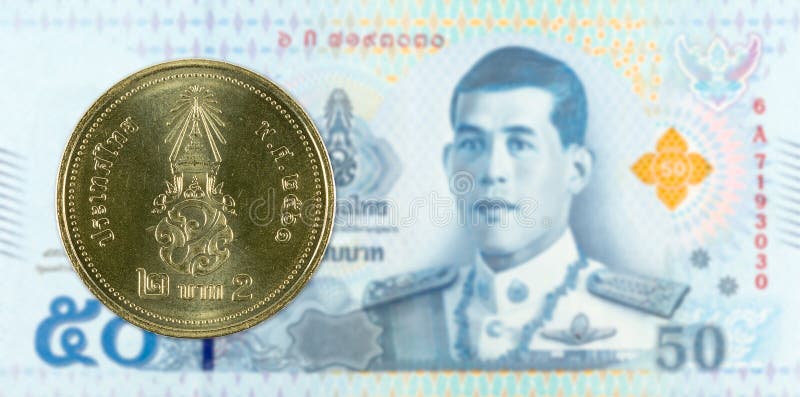 2 New Thai Baht Coin Against 50 New Thai Baht Banknote Stock Photo ...