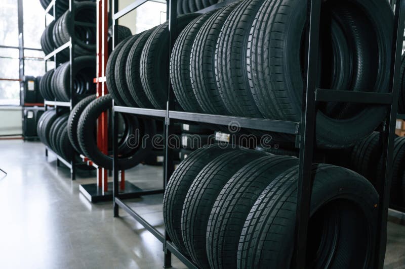 New Tires are Placed on the Storage Rack in the Car Workshop Stock ...