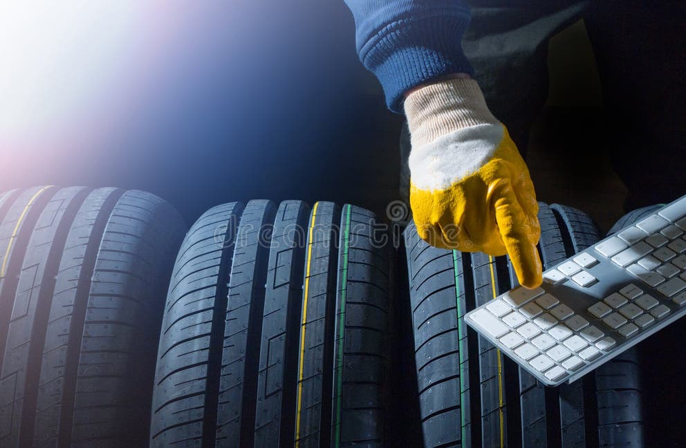 New Tires Search Concept with Worker Hands and Computer Keyboard and ...
