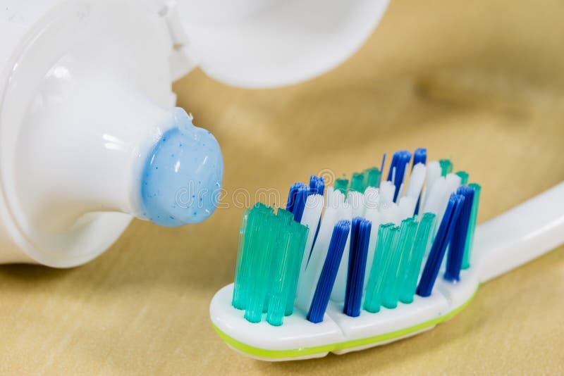 A New Toothbrush. Toothpaste Arranged on the Bristles of a Tooth Stock ...