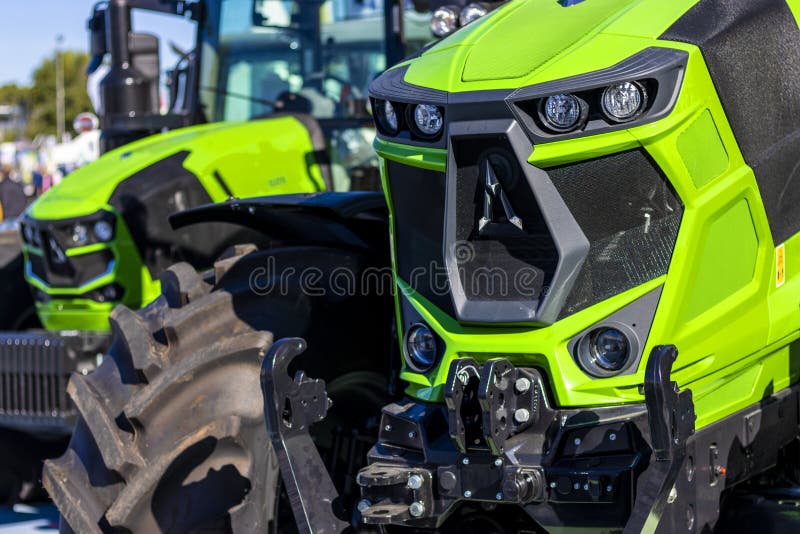 New Tractors at a Livestock Show Stock Photo - Image of working, plow ...