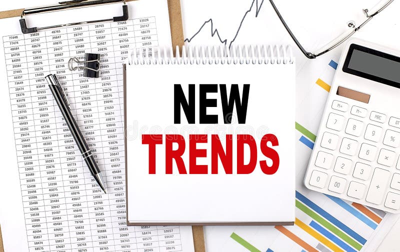 NEW TRENDS Text on Notebook with Chart, Calculator and Pen Stock Photo ...