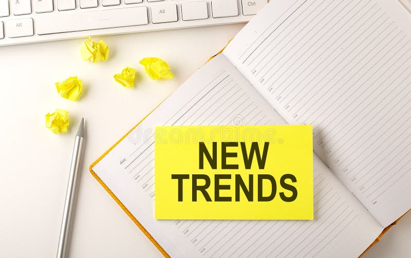 NEW TRENDS Text on Sticker on the Diary with Keyboard and Pencil Stock ...