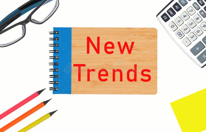 NEW TRENDS Text Written on a Notepad. New Business Trends. Latest and ...