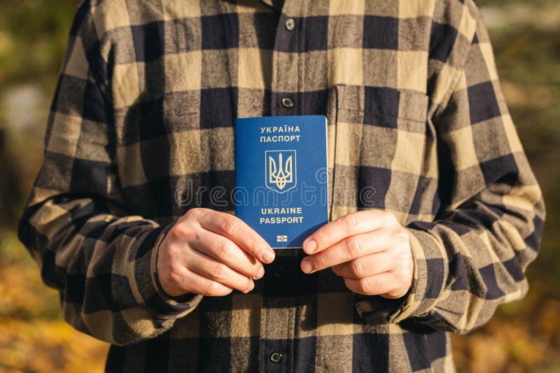 New Ukrainian Blue Biometric Passport with Identification Chip in Hands ... New Ukrainian Blue Biometric Passport with Identification Chip in Hands ...