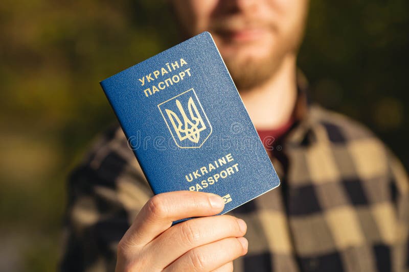 New Ukrainian Blue Biometric Passport with Identification Chip in Hands ... New Ukrainian Blue Biometric Passport with Identification Chip in Hands ...