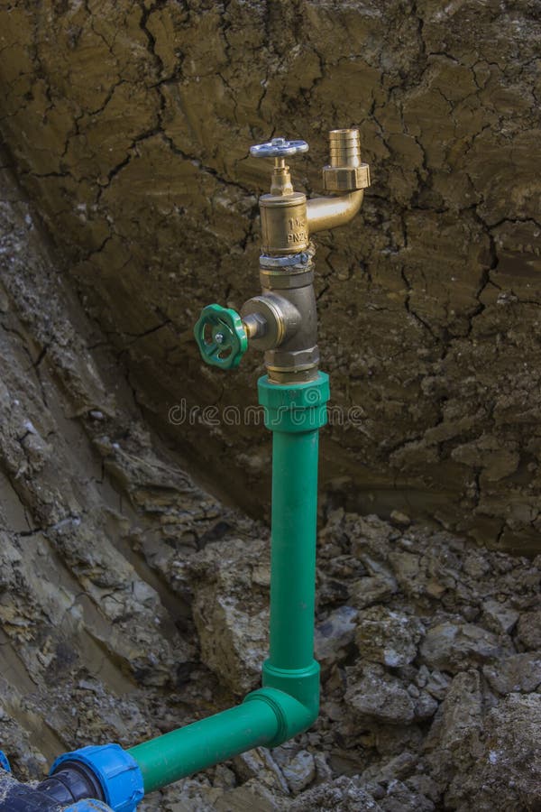 New Water Supply - Hole in the Ground with Pipe and Water Valve Stock ...