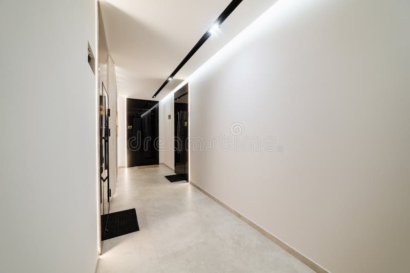 New White Corridor with Black Doors and Light Stock Image - Image of ...