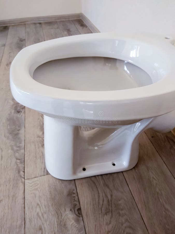 New White Toilet Bowl in the Bathroom Side View Stock Image - Image of ...