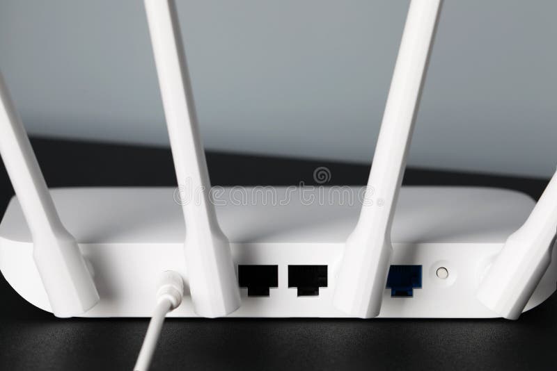 New White Wi-Fi Router on Black Table, Back View Stock Photo - Image of ...
