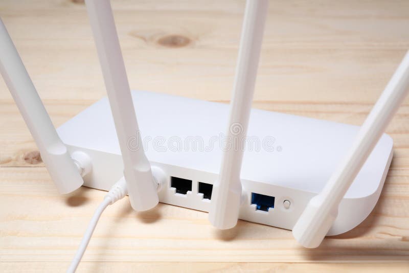 New White Wi-Fi Router on Wooden Table, Closeup Stock Image - Image of ...