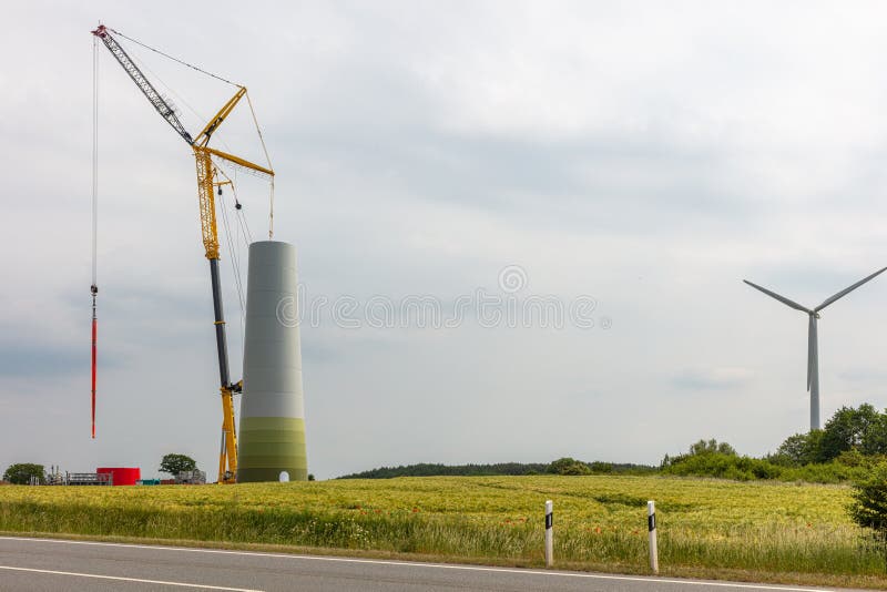 New Wind Power Plant is Built on a Field, Half of the Tower is Already ...