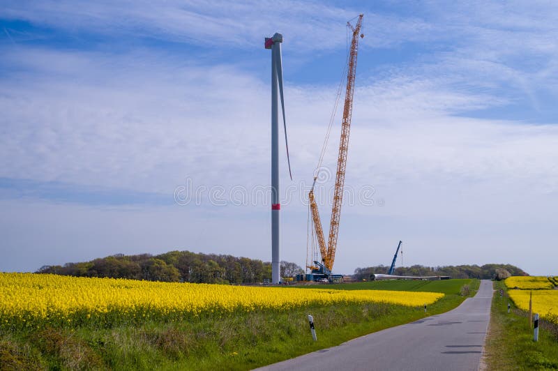A New Wind Turbine is Erected on a Field Stock Image - Image of ...
