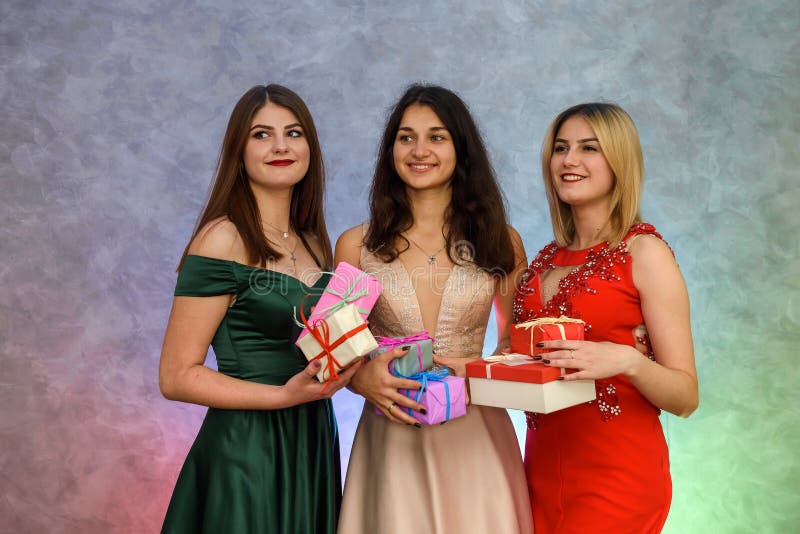 New Year Celebration. Three Girls with Gift Boxes Posing on New Year ...
