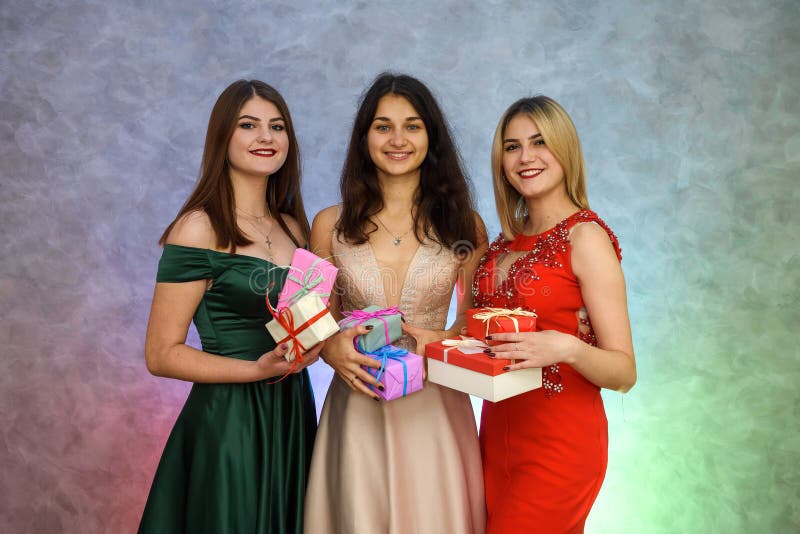 New Year Celebration. Three Girls with Gift Boxes Posing on New Year ...