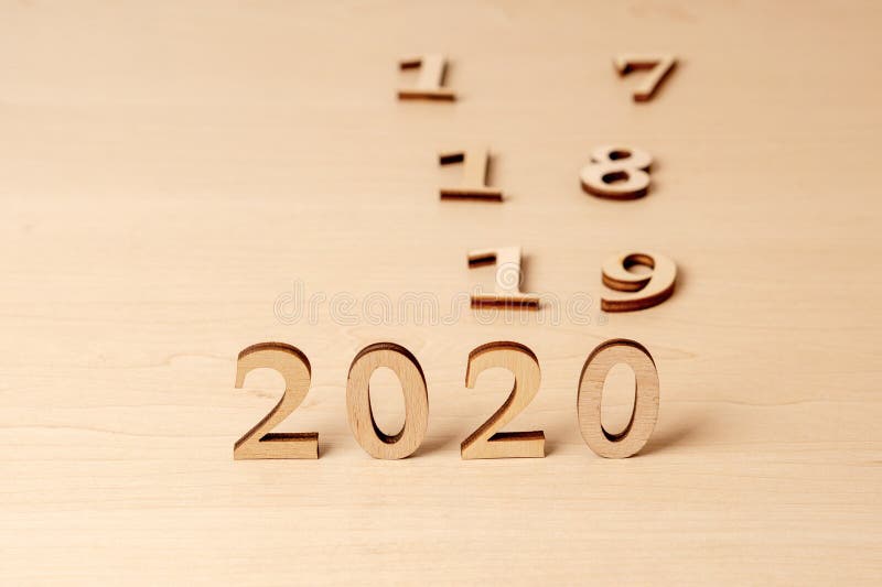 2020 New Year Change 2019, 2018 and 2017. Wooden Numbers on a Light ...