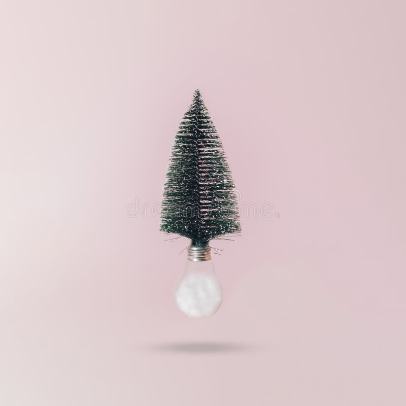 New Year Christmas Tree with a Light Bulb and Cotton Wool As Snow ...