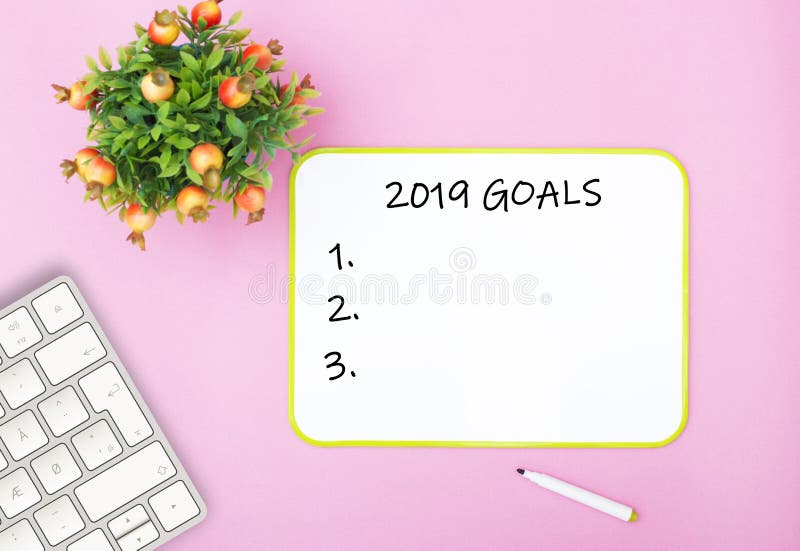 New Year Goals Check List on the Modern Pink Office Table Stock Image ...