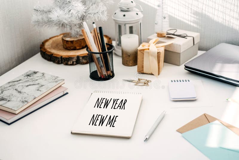 NEW YEAR NEW ME Text in Open Notepad on Table at Home. Setting Goals ...