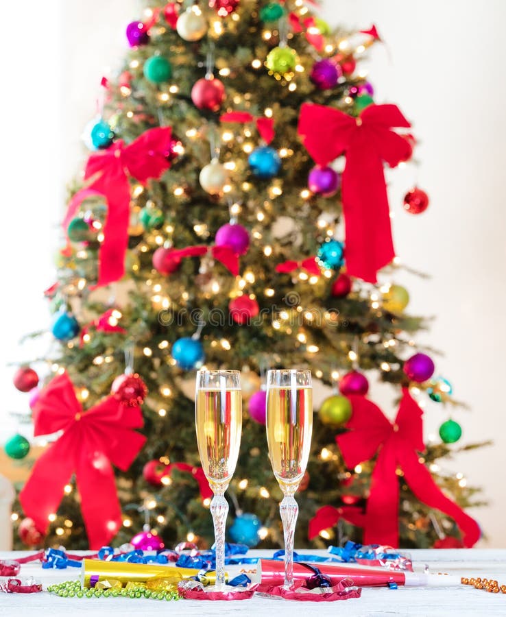 New Year Party Objects with Christmas Tree in Background Stock Photo ...