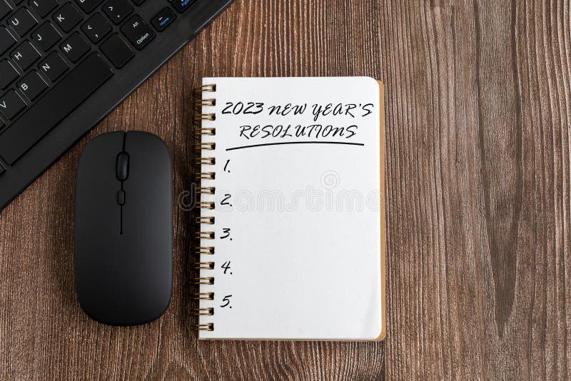 2023 New Year`s Resolutions Text on Note Pad on Top of Wood Desk Flat ...