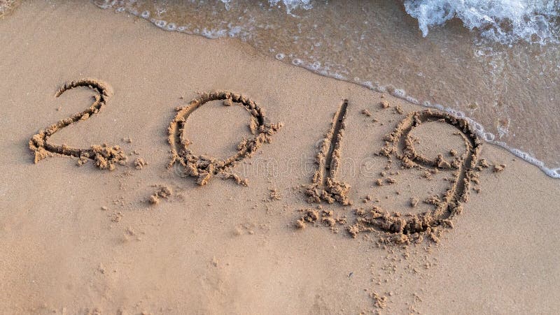 New Year 2019 Written on Sand Beach and Ocean Wave. Lettering on the ...