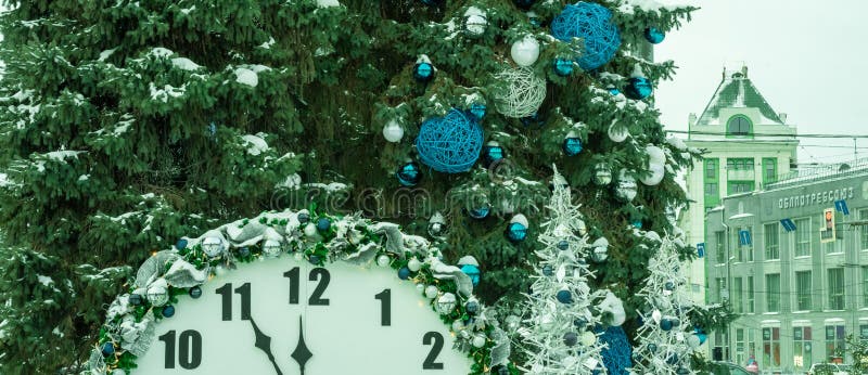 New Years Eve. Clock Face and Christmas Trees in the Snow Stock Image ...