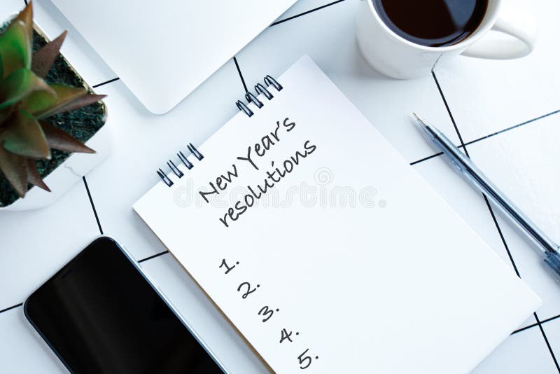 New Years Resolutions on Notebook with Notebook, Cup of Coffee and ...