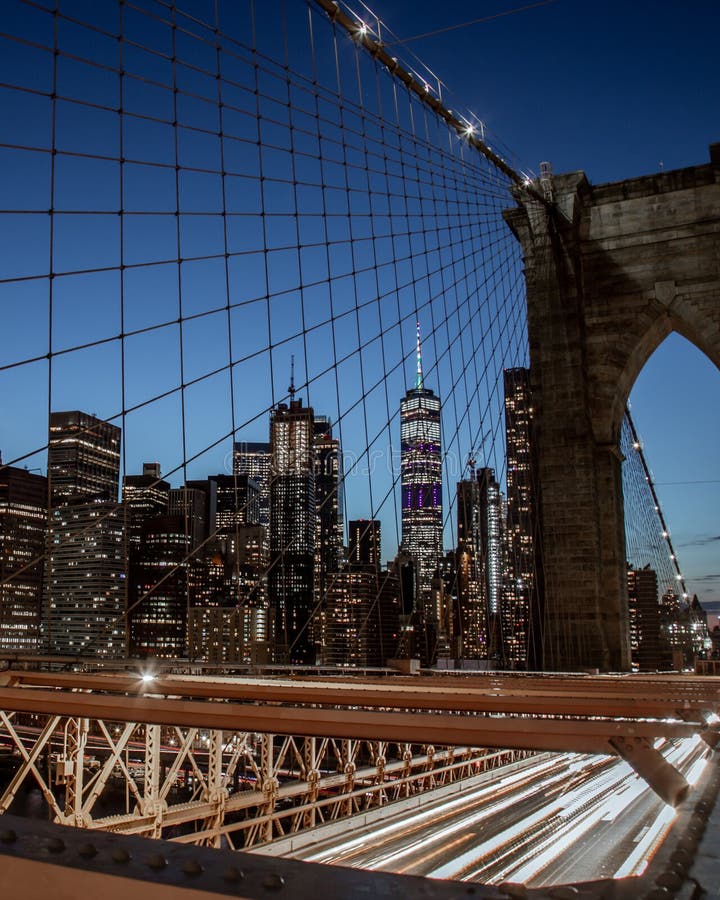New York City in the Evening Seen through Brooklyn Bridge Cables ...