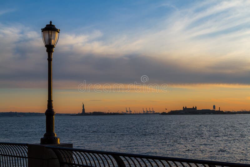 New York Harbor at Sunset stock photo. Image of lightpole - 41868416
