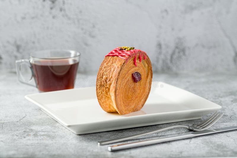 New York Roll or Round Croissant with Marmalade with Tea on Stone Table ...