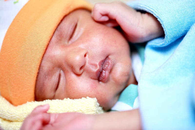 Newborn baby close up stock image. Image of holding - 152200907