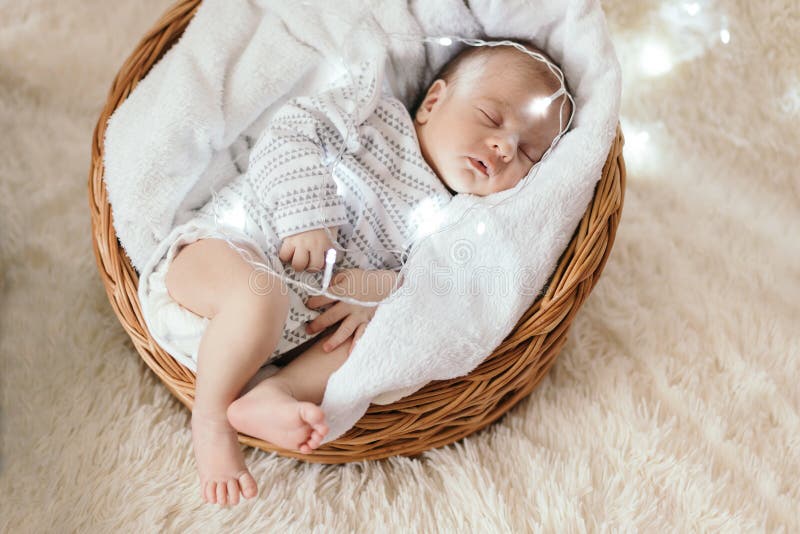 Newborn Baby is Fast Asleep in a Baby Basket. Stock Image - Image of ...