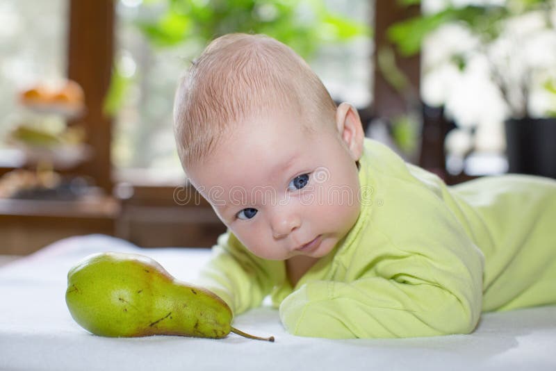 Newborn Baby Girl with a with Fruit Pear. Stock Image - Image of girl ...