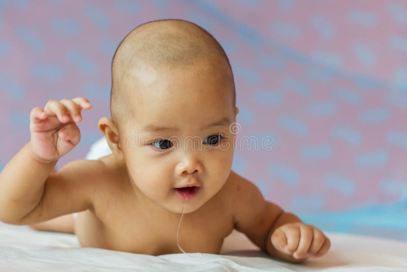 Newborn Baby Looking at the Camera Stock Image - Image of ground ...