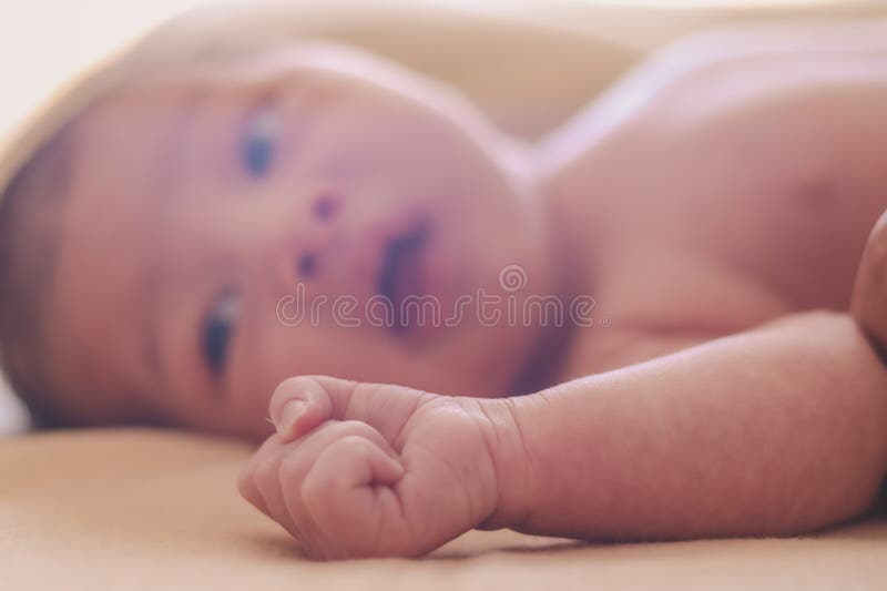 Newborn Baby S Hand with Face in Background Stock Image - Image of ...