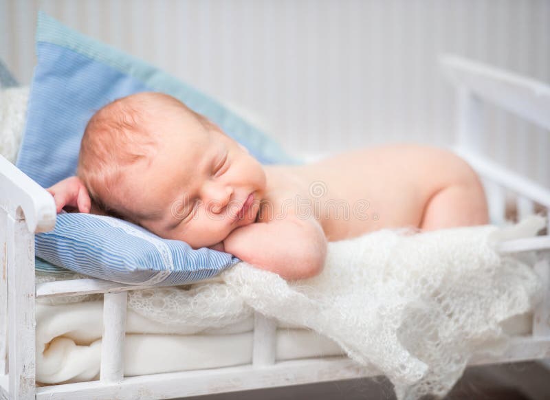 Newborn Baby in a Small Bed Stock Photo - Image of little, head: 41241922