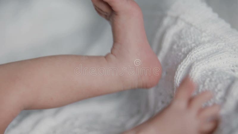 Newborn baby wiggles feet stock footage. Video of foot - 53274500