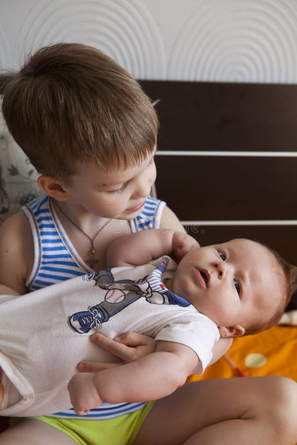 Newborn Baby and 5 Years Old Brother Stock Image - Image of hand ...