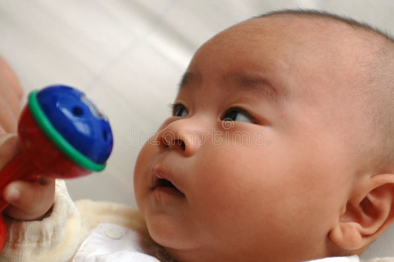 Chinese baby face smirking stock photo. Image of looking - 19376676
