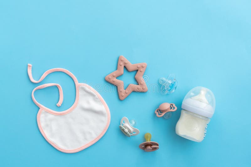 Newborn Essentials and Pacifiers on Serene Blue, Top View with Space ...
