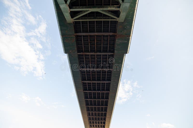 A Bridge from Underneath Reflected in Water. a Dividing Line between ...
