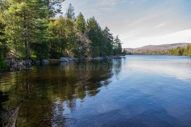 Newcomb Lake on a Clear Day Stock Photo - Image of forest, hike: 210259930