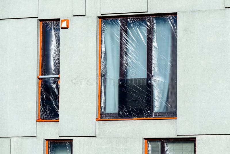 Newly Built Building Windows Covered with Tightly Stretched Plastic ...