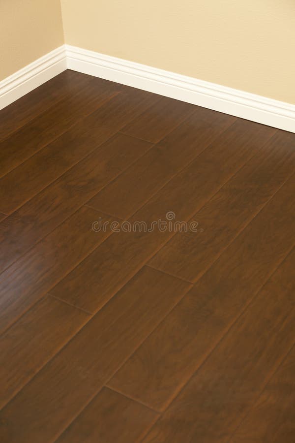 Newly Installed Brown Laminate Flooring and Baseboards in Home Stock ...