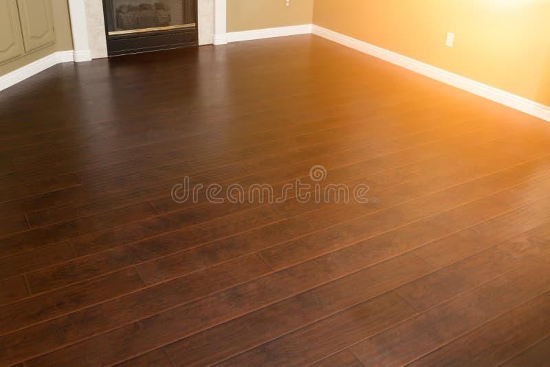 Newly Installed Brown Laminate Flooring and Baseboards in Home Stock ...