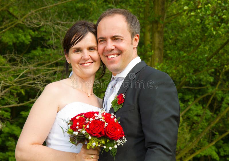 Newly Married Couple with Red Roses Stock Photo - Image of affection ...