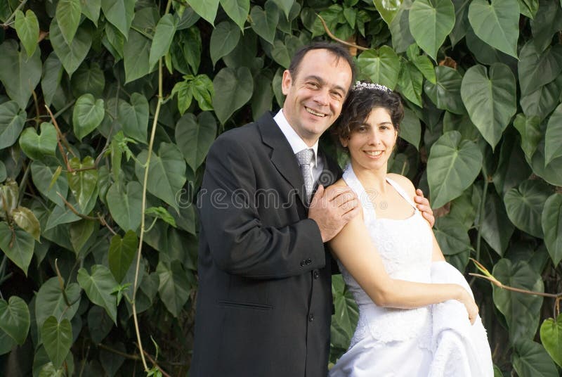 Newly Married Couple Smile At Camera - Vertical Stock Photo - Image of ...