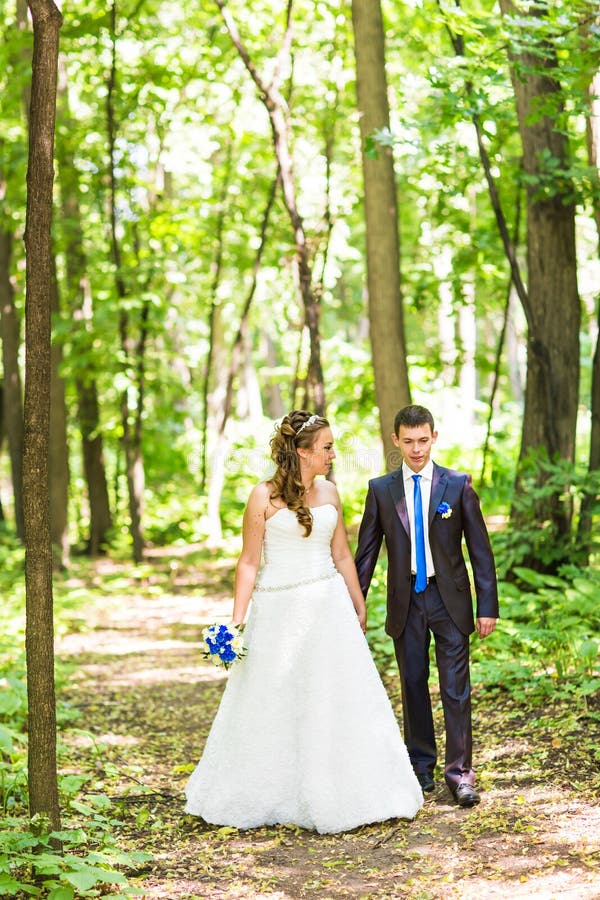 Newly Married Couple Walk Park Paths Holding Hands Stock Photos - Free ...